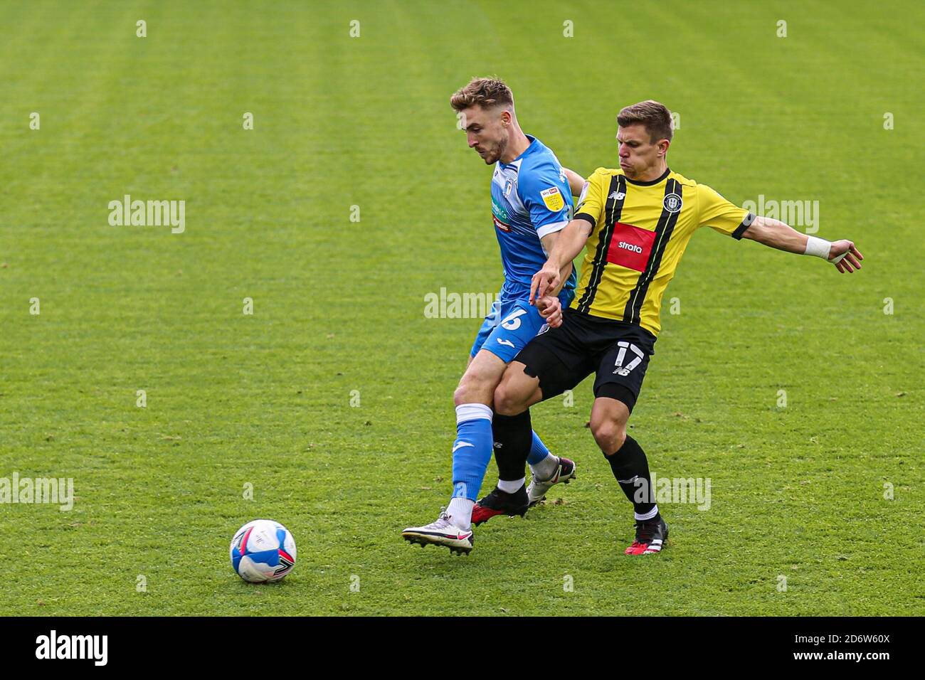 Tom Beadling (16) of Barrow and Lloyd Kerry (17) of Harrogate Town ...