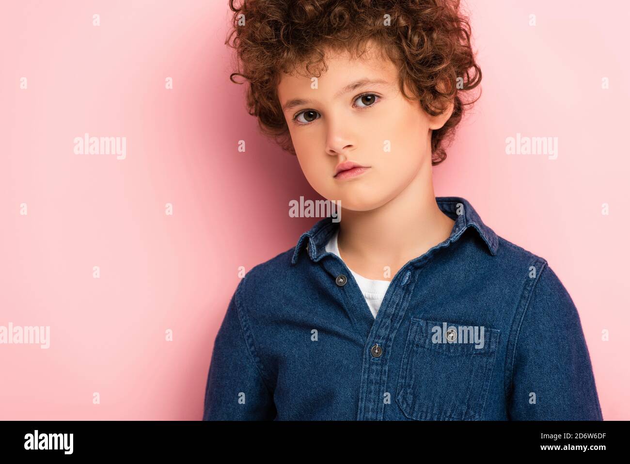 Serious curly boy in hi-res stock photography and images - Alamy
