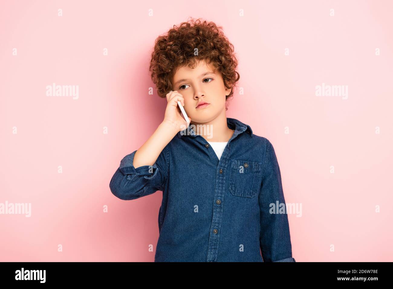 Curly boy in denim hi-res stock photography and images - Alamy