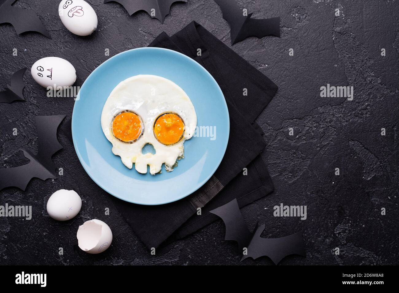Fried eggs in the shape of a skull. Halloween breakfast Stock Photo - Alamy