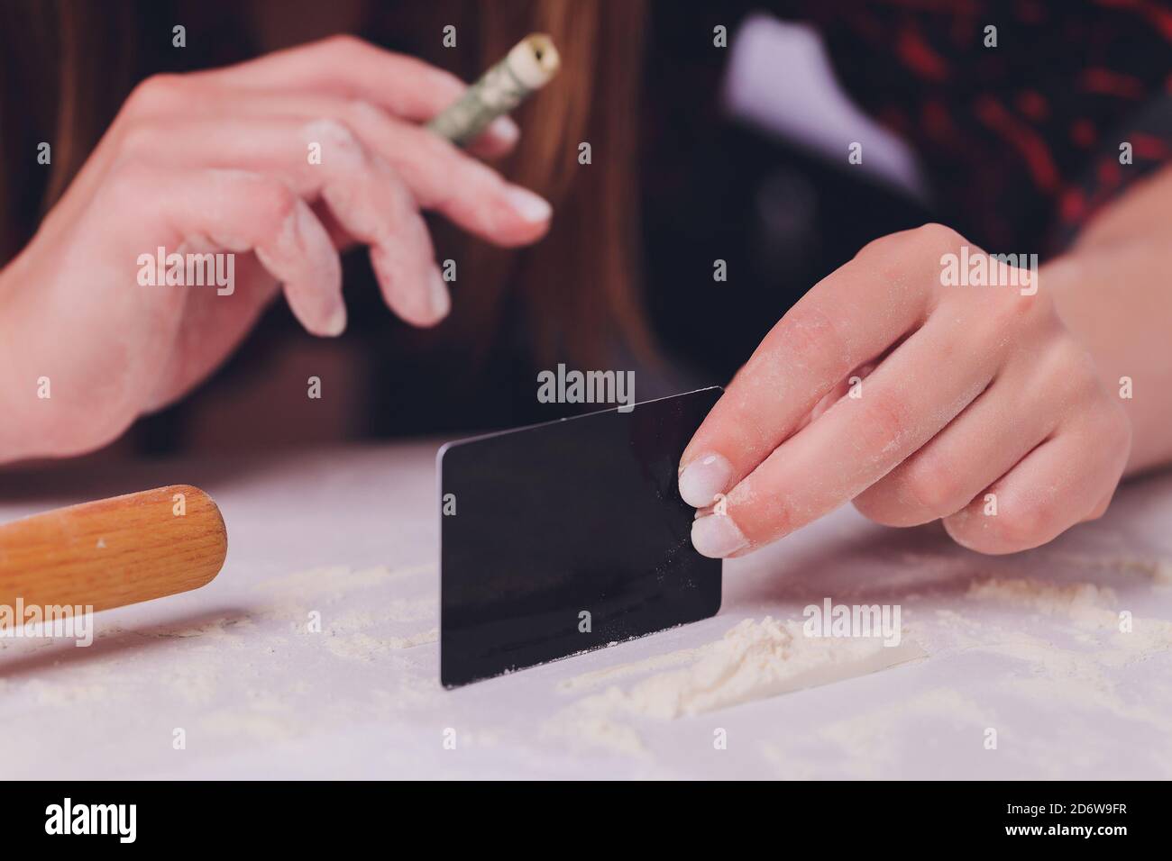 Swag girl sniffing cocaine imitation, flour . blonde Woman stoned ...