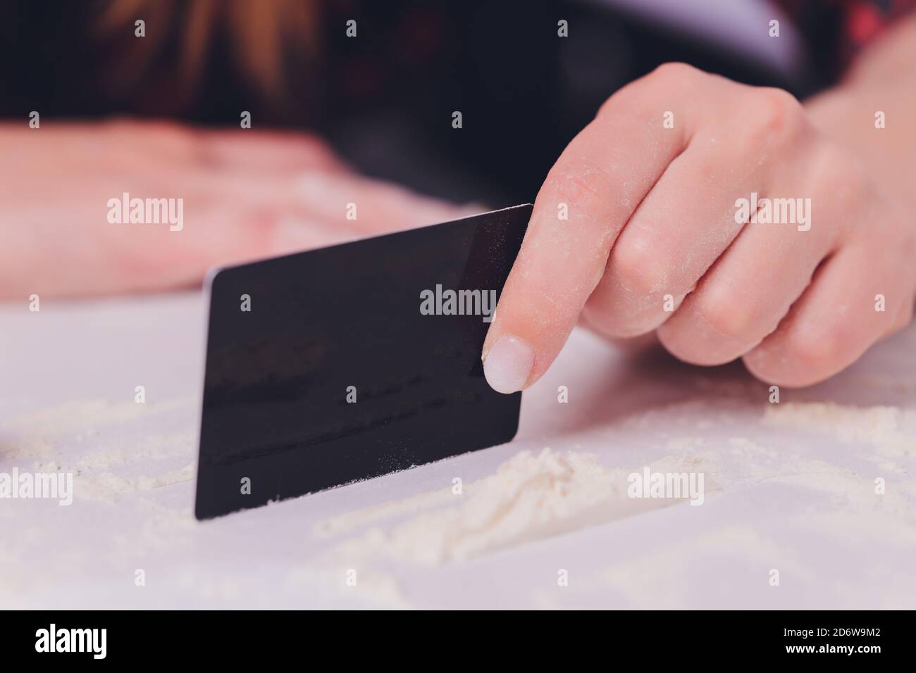 Swag girl sniffing cocaine imitation, flour . blonde Woman stoned ...