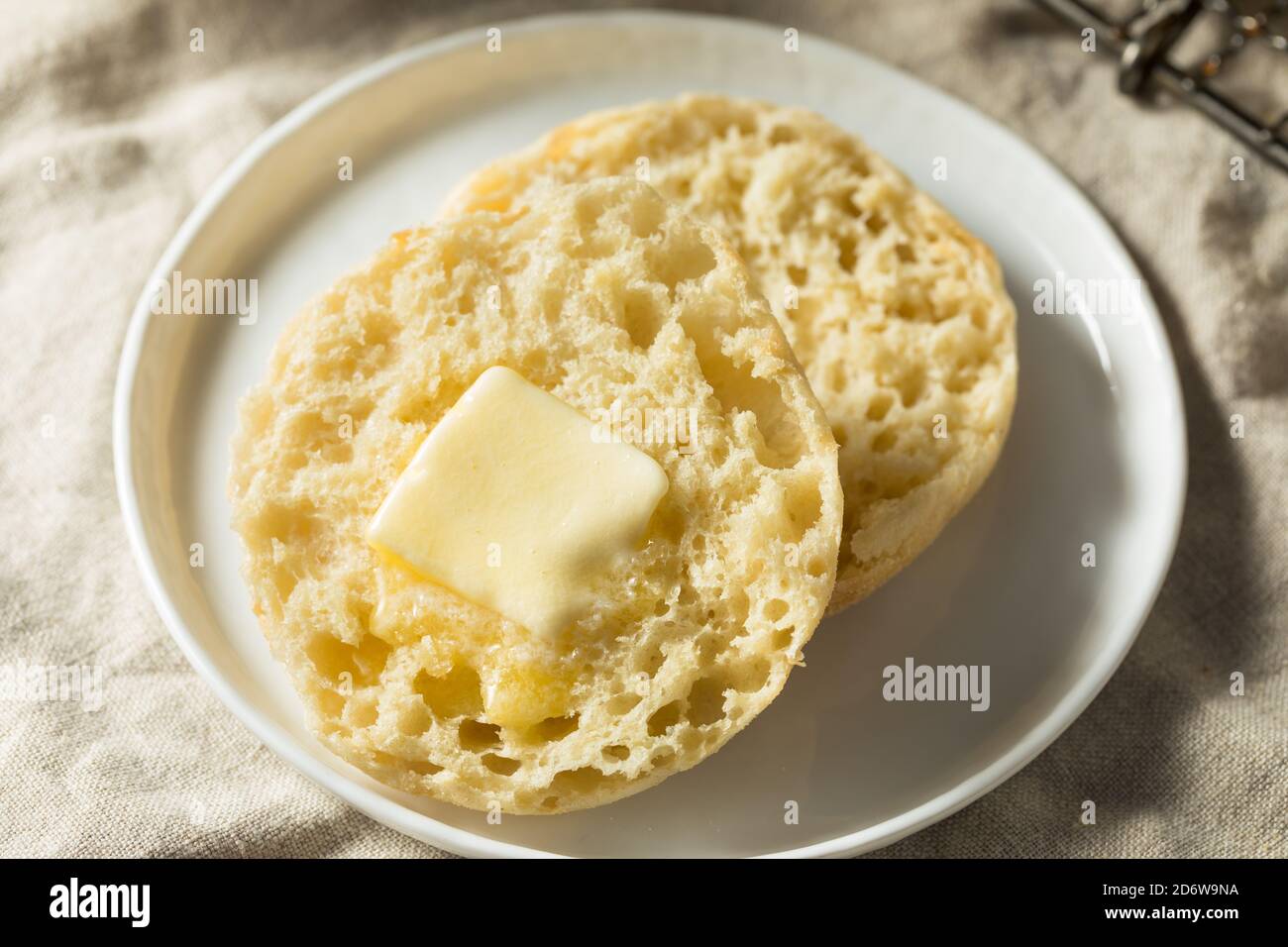 Homemade Toasted English Muffins with a Tab of Butter Stock Photo - Alamy