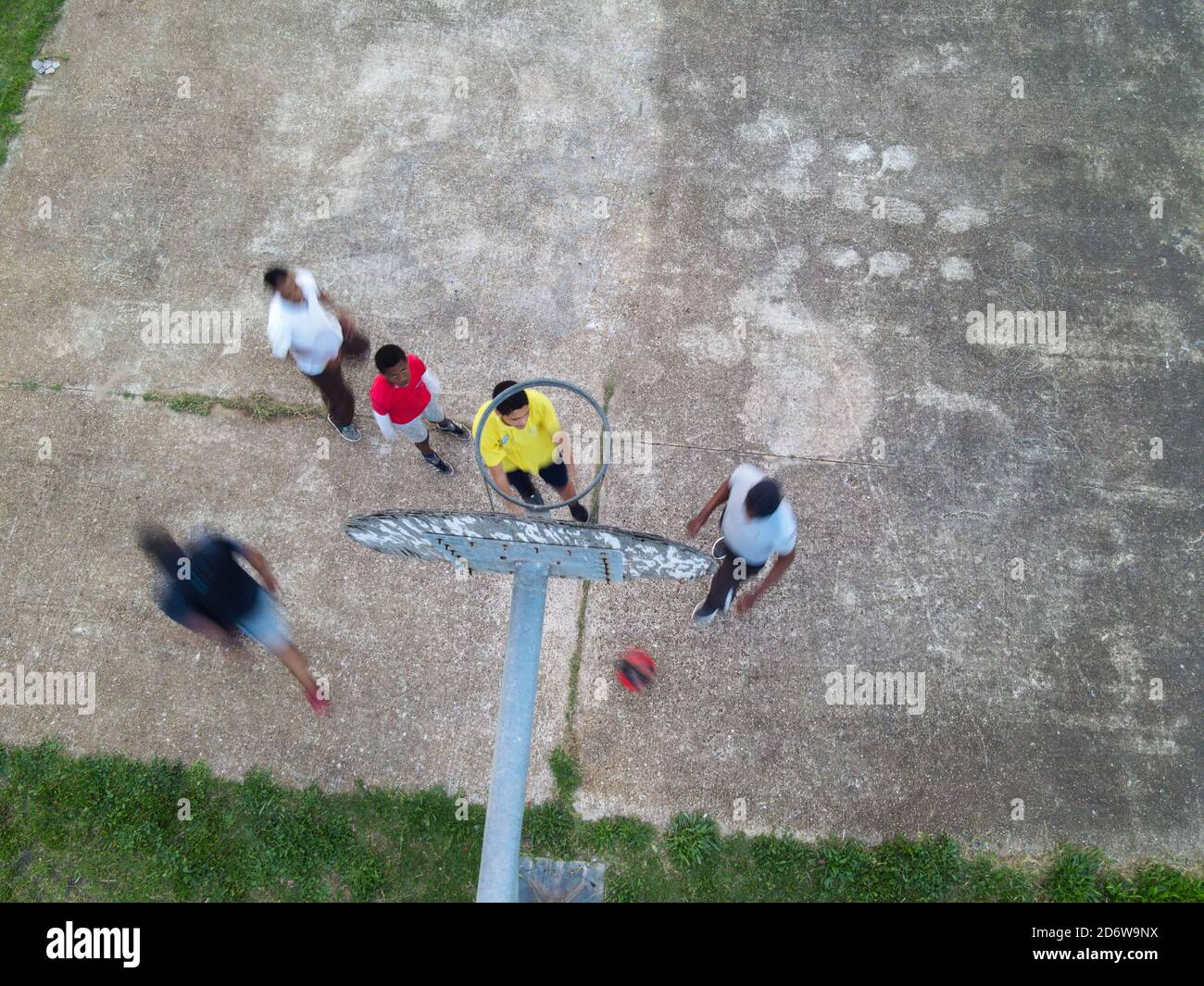 Group of young men playing basketball outdoors Stock Photo - Alamy