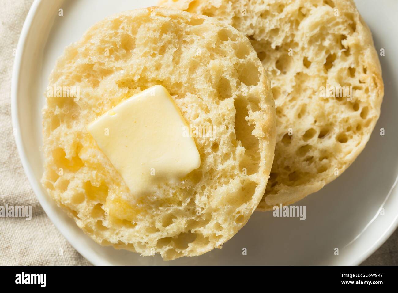 Homemade Toasted English Muffins with a Tab of Butter Stock Photo - Alamy