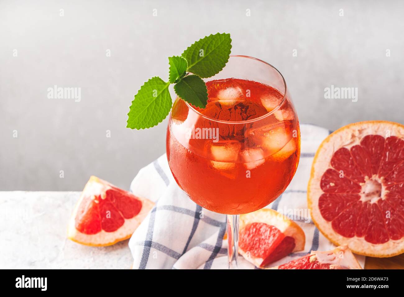 Alcohol Aperol drink with grapefruit in glass Stock Photo - Alamy
