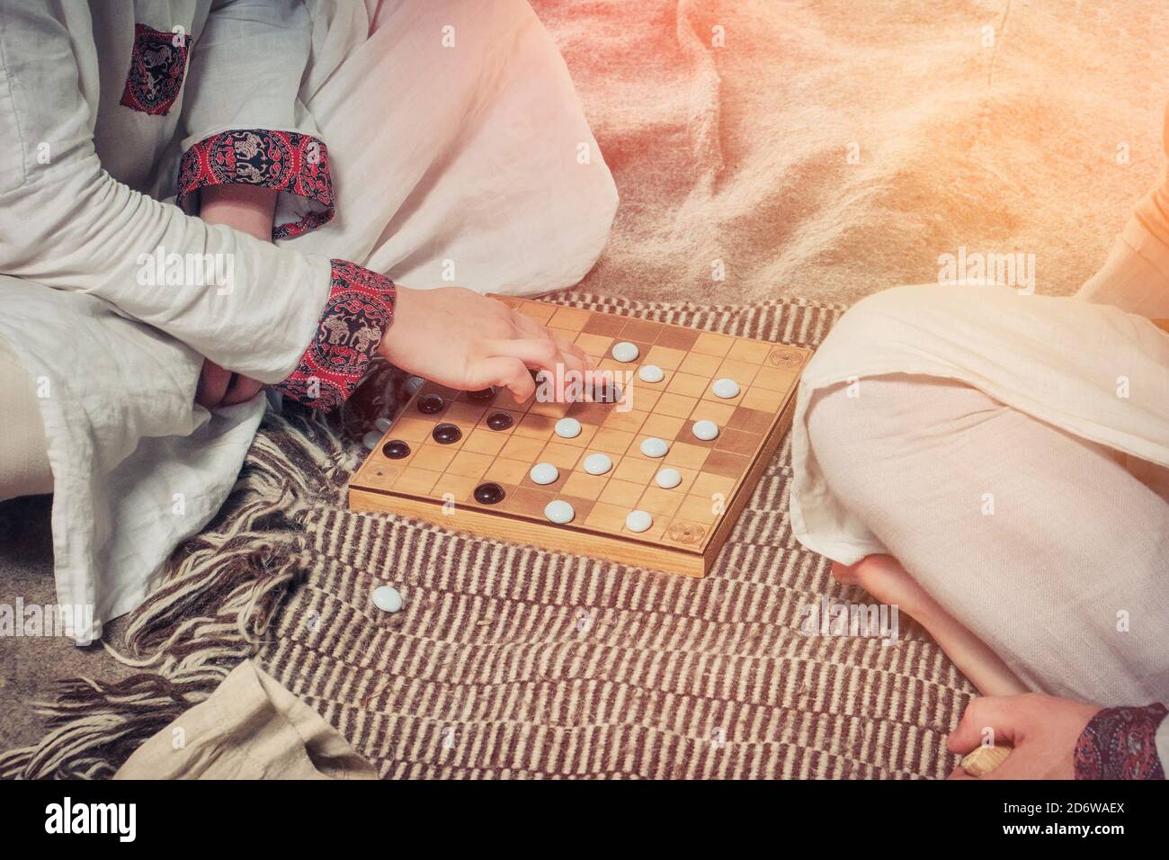 Tafl is a Scandinavian boardgame. Players at the Board game a retro ...
