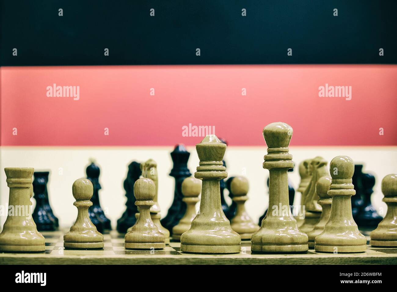 Flag of Germany on the background of chess with white pieces on the ...