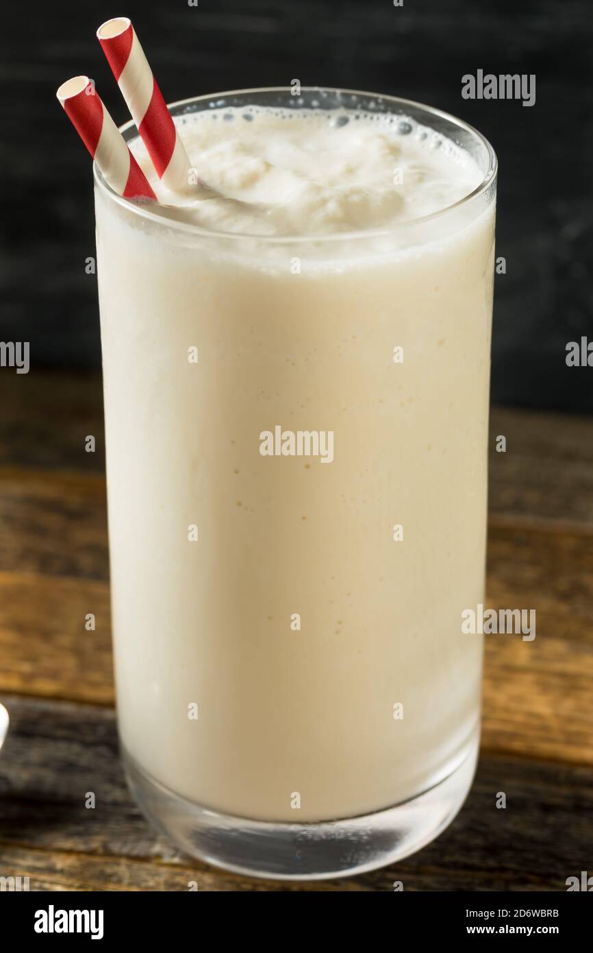 Homemade Frozen Vanilla Milkshake with a Straw Stock Photo - Alamy