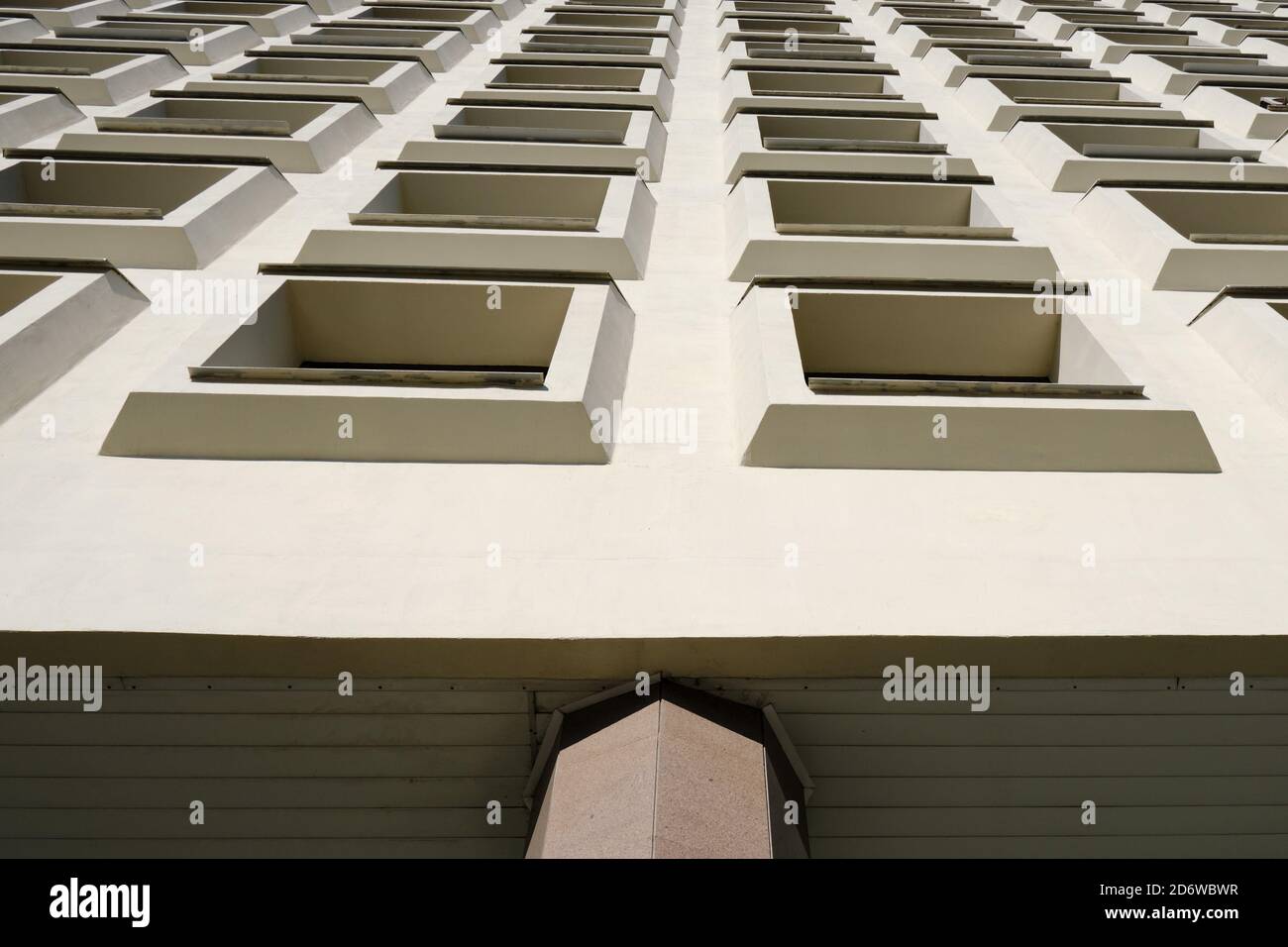 Uniform windows of a concrete building with a column going up Stock ...