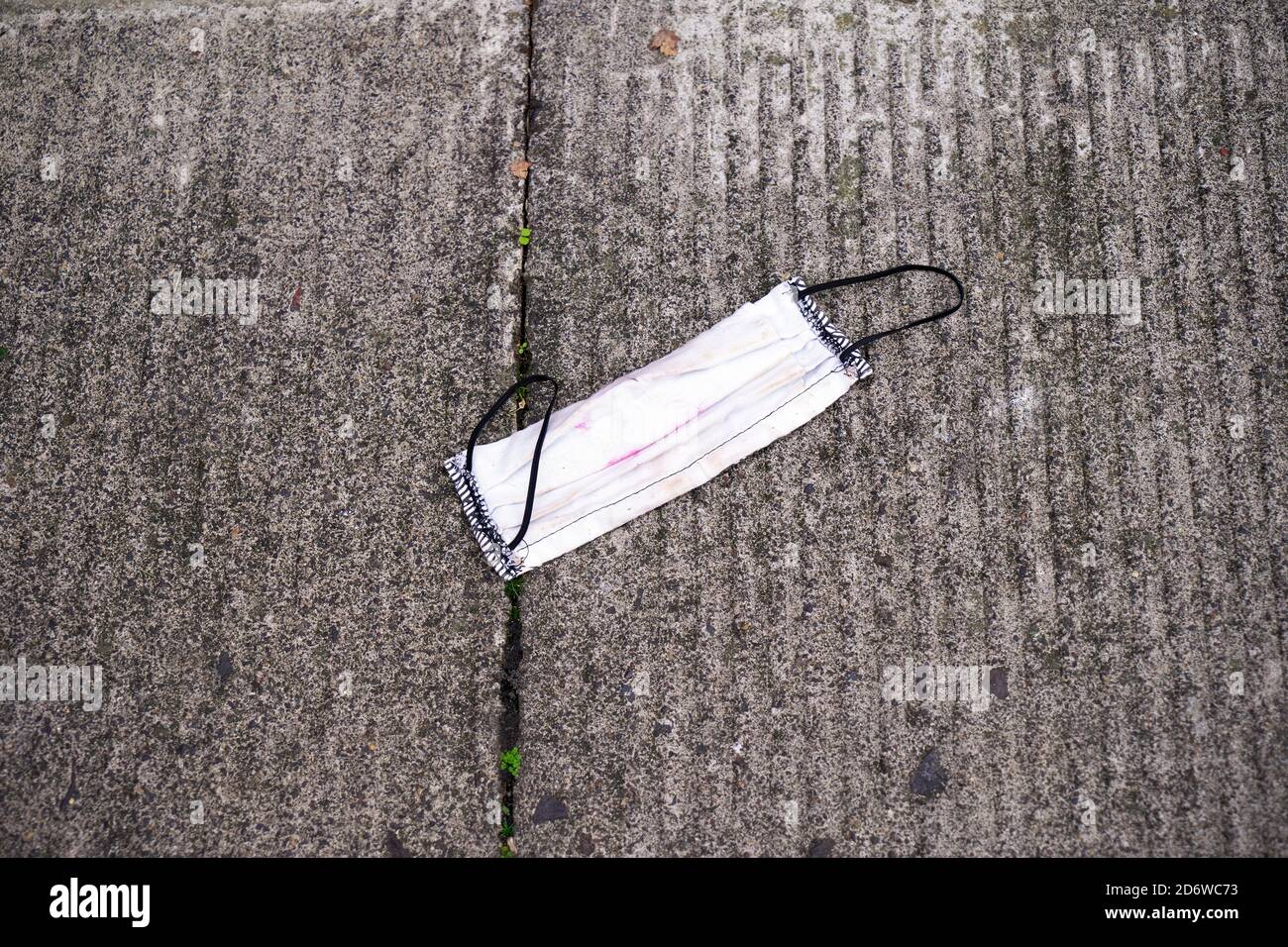Discarded disposable PPE face mask Stock Photo - Alamy
