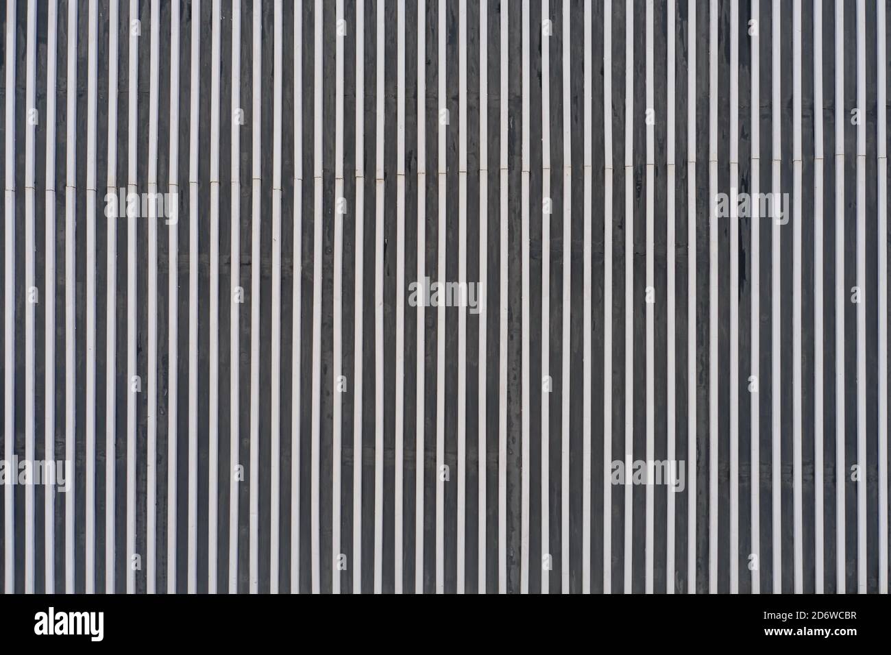 Background in the form of smooth vertical metal lines Stock Photo - Alamy