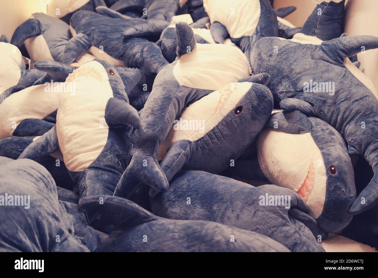 A lot of toy sharks in the store, background Stock Photo - Alamy