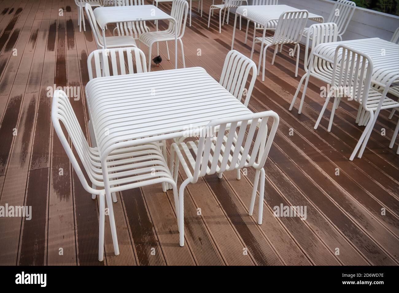 Lattice furniture in the cafe, white tables and chairs Stock Photo - Alamy