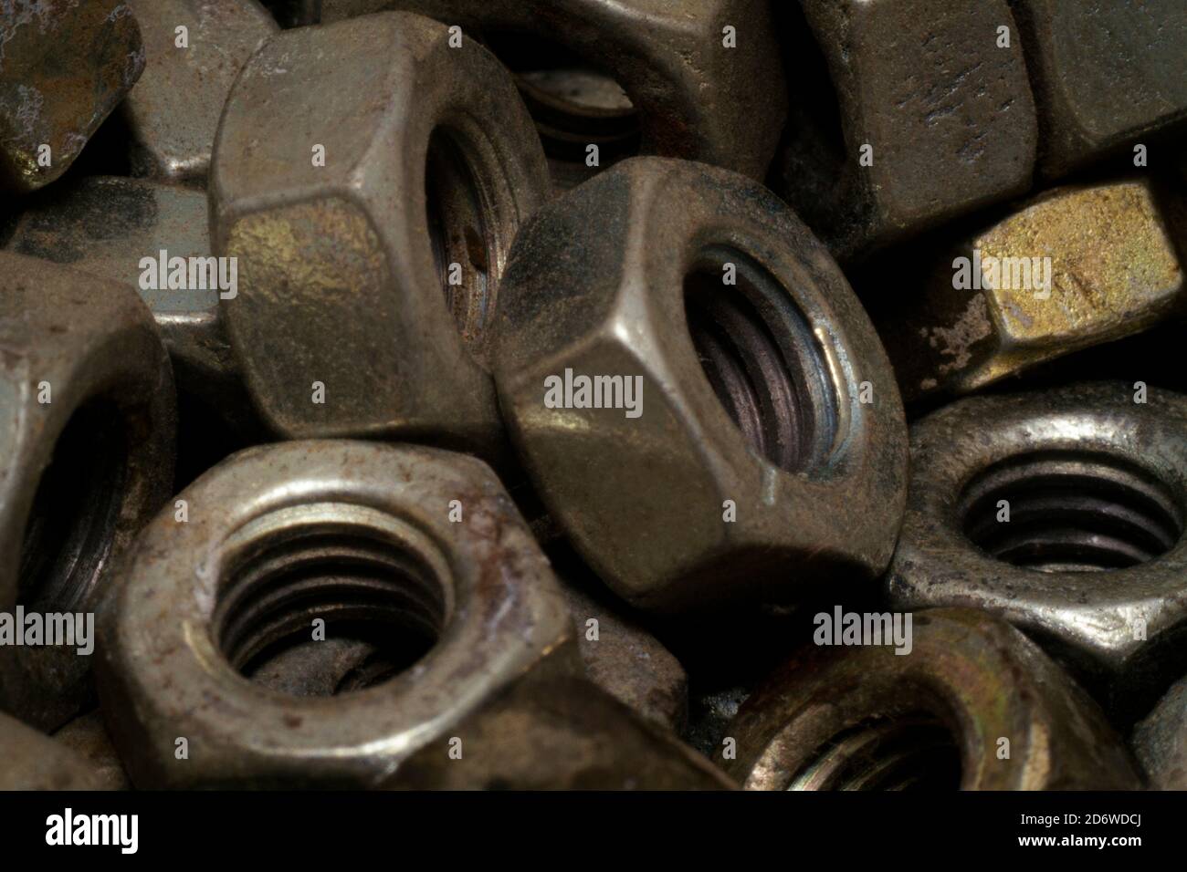 Macro shot stacked of dusty nuts in the workshop Stock Photo - Alamy