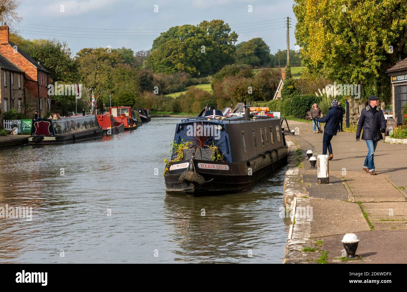 canal barges and narrowboats on the towpath of the grand union canal at stoke bruerne ...