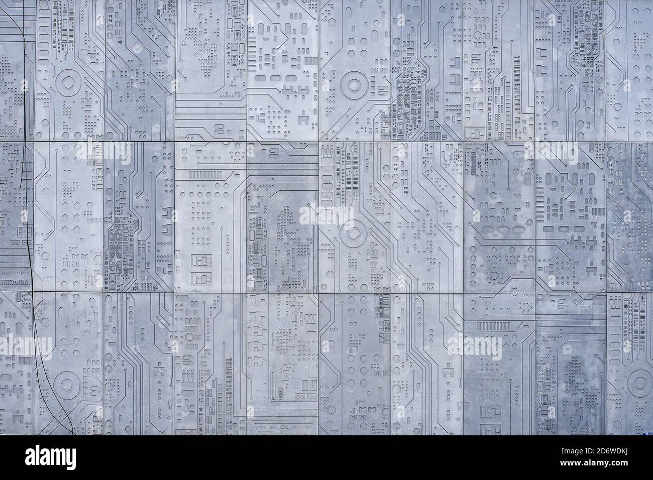 Texture of a stone wall with a carved pattern of a computer circuit ...