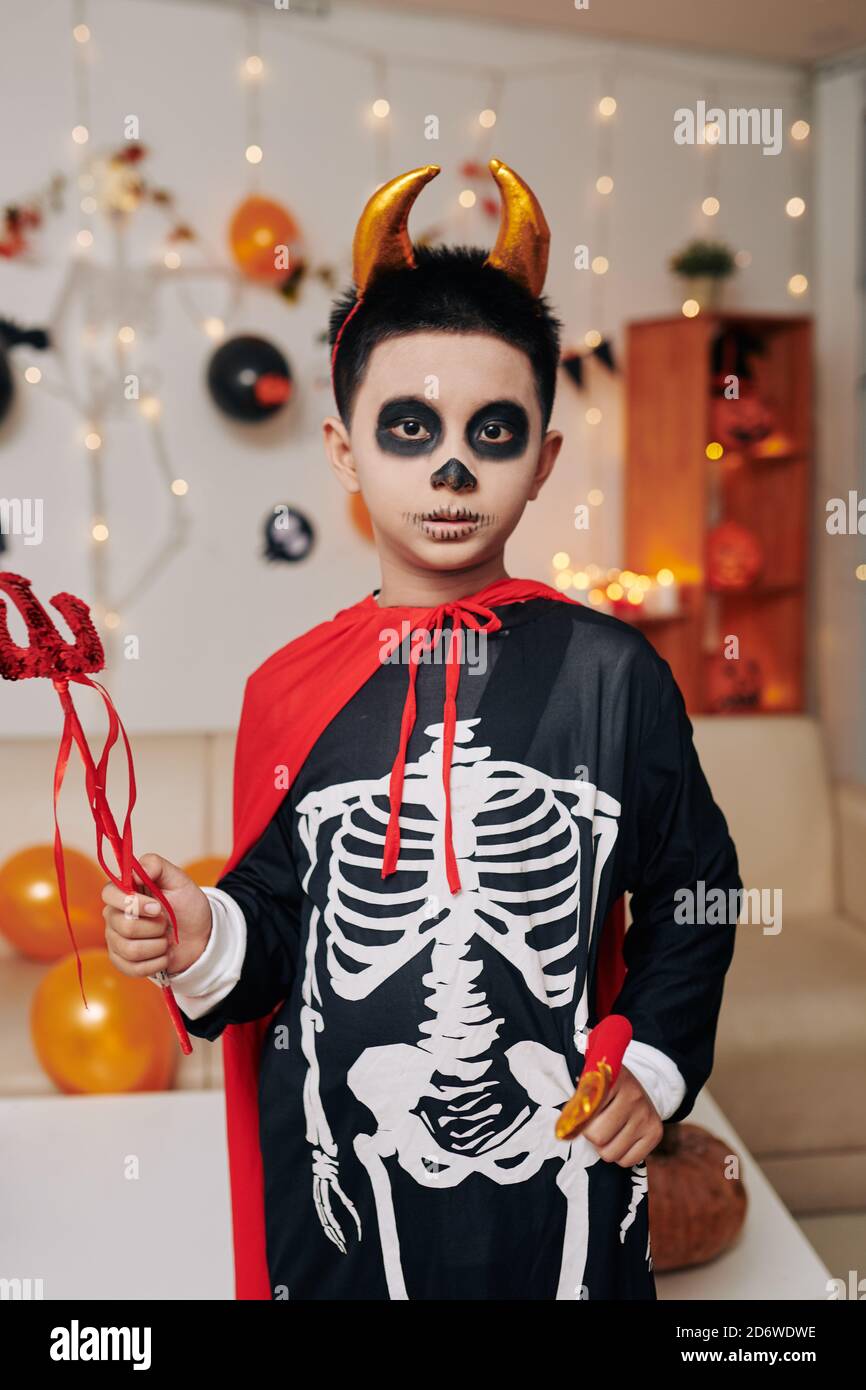 Confident boy dressed as devil Stock Photo - Alamy