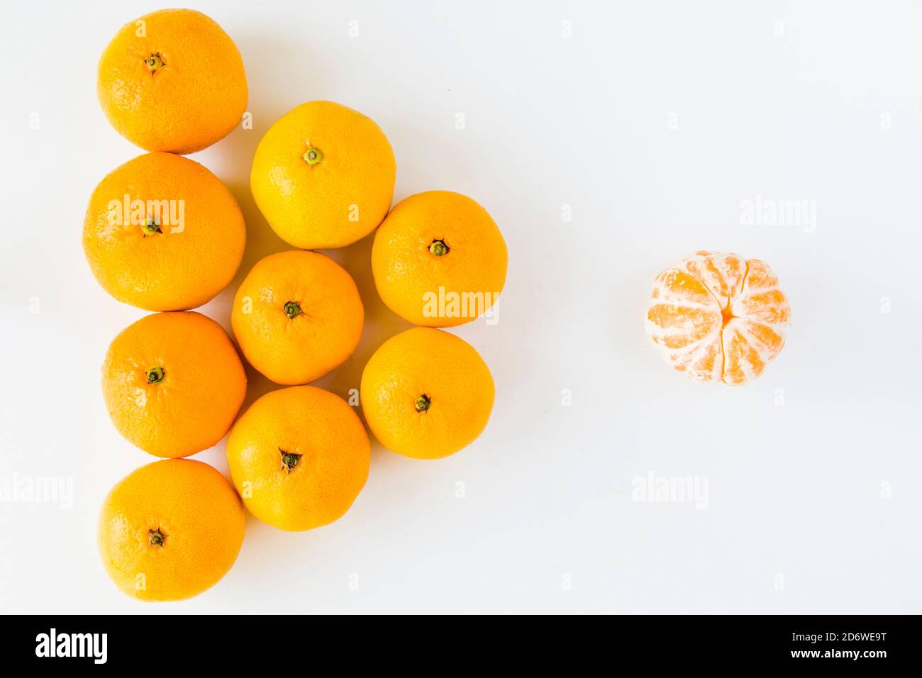 large group of the clementines on the white background, orange color ...