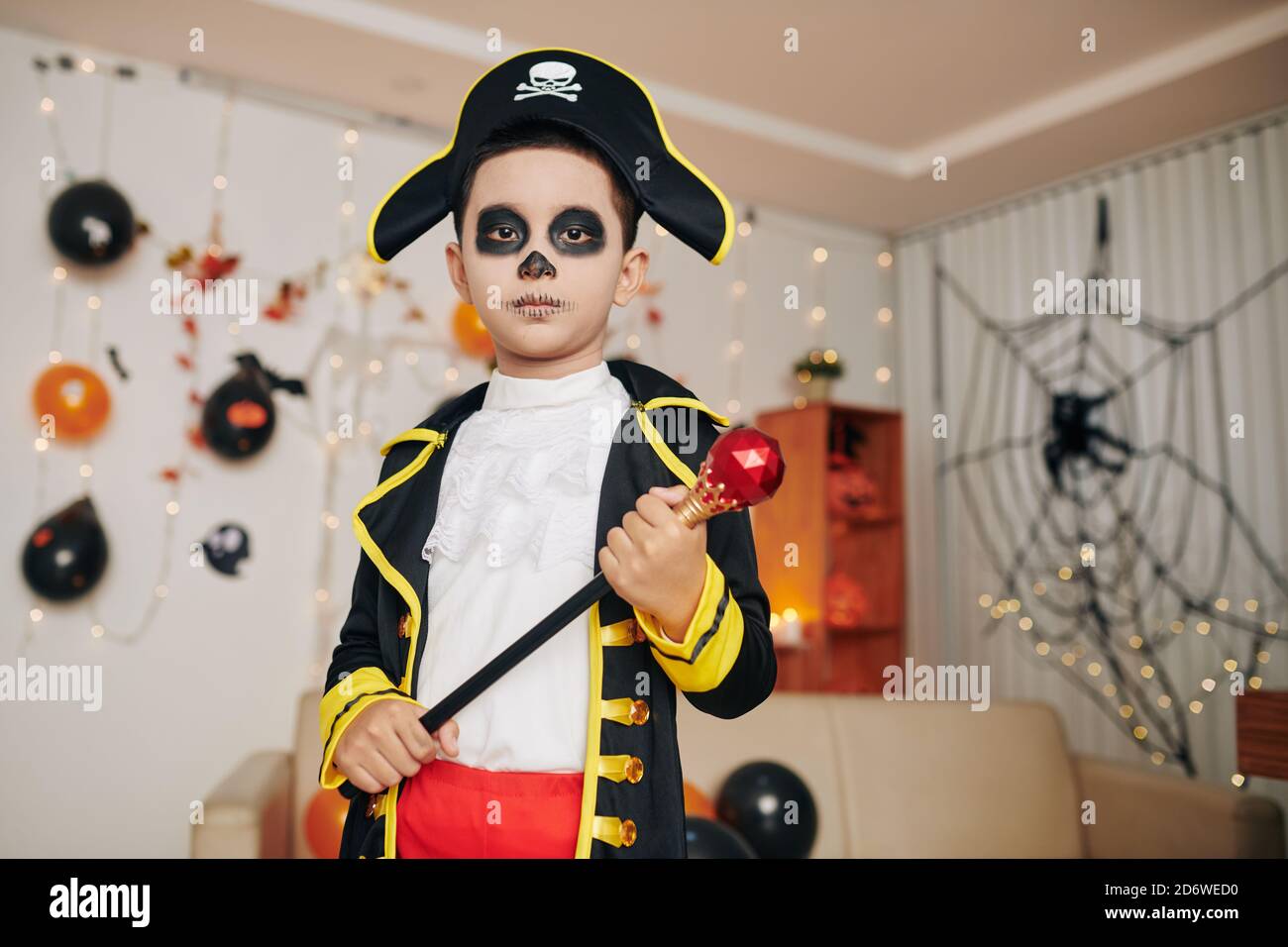 Serious boy at Halloween party Stock Photo - Alamy