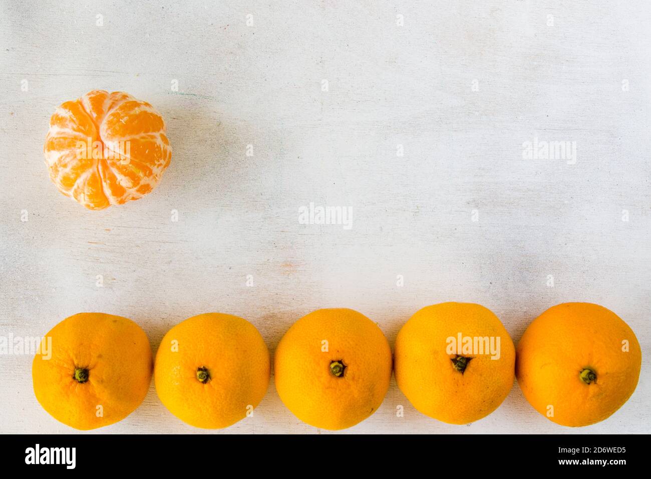 large group of the clementines on the white background, orange color ...