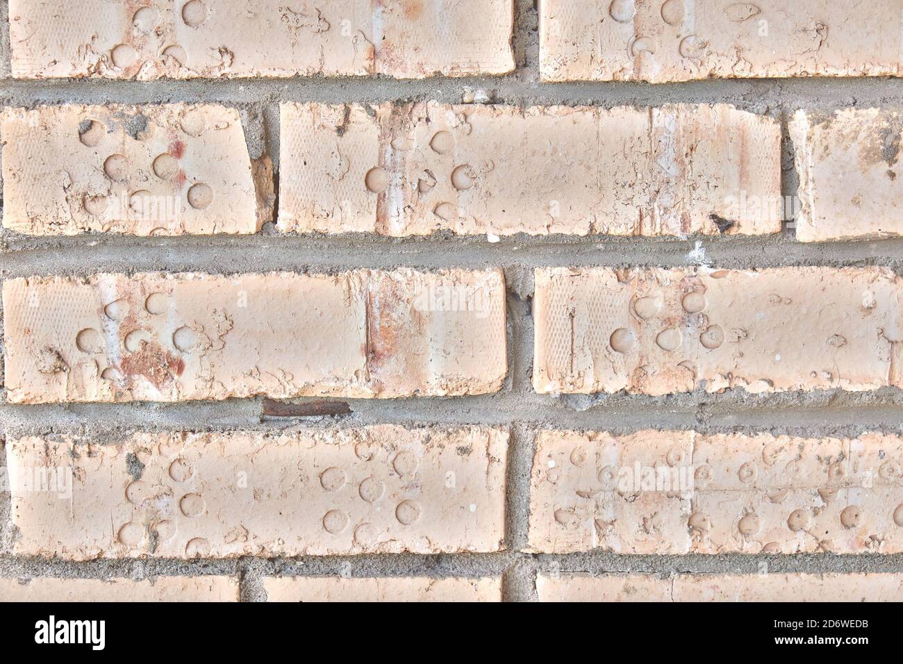 Background in the form of brickwork with round dents. The texture of ...