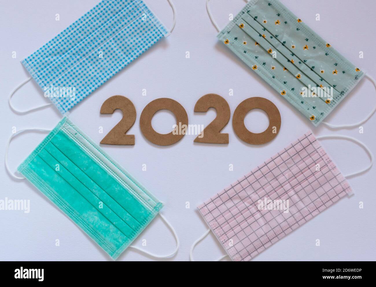 Face masks and 2020 number top view white background Stock Photo - Alamy