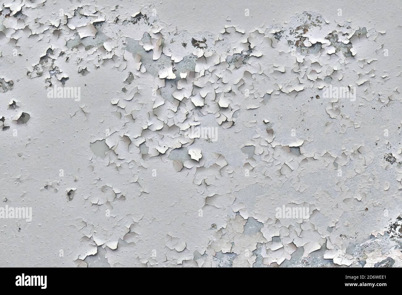 Cracked painting of the old surface. Background of plaster peeling from ...