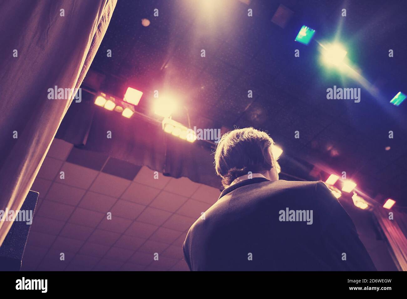 The concert director watches from behind the scenes of the performance ...