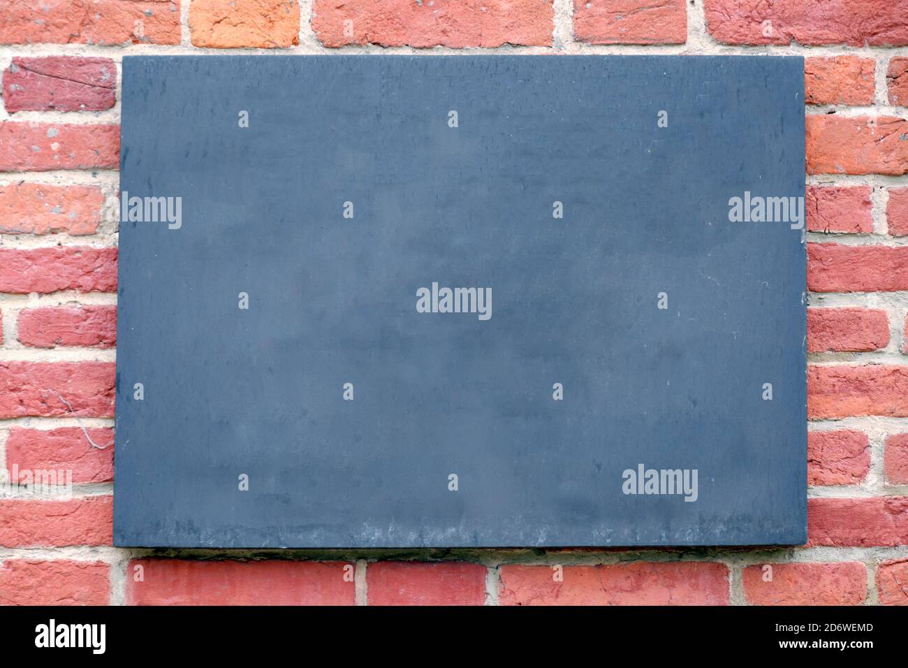 Vintage blank plate for text on brick wall background Stock Photo - Alamy