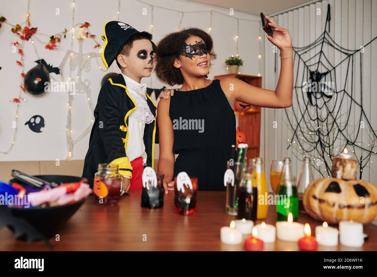 Talking selfie at Halloween party Stock Photo - Alamy
