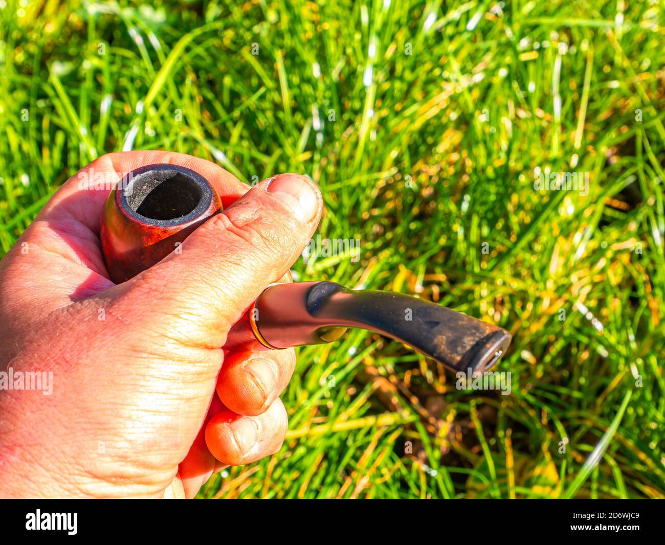 Old man smoking pipe fire hi-res stock photography and images - Alamy