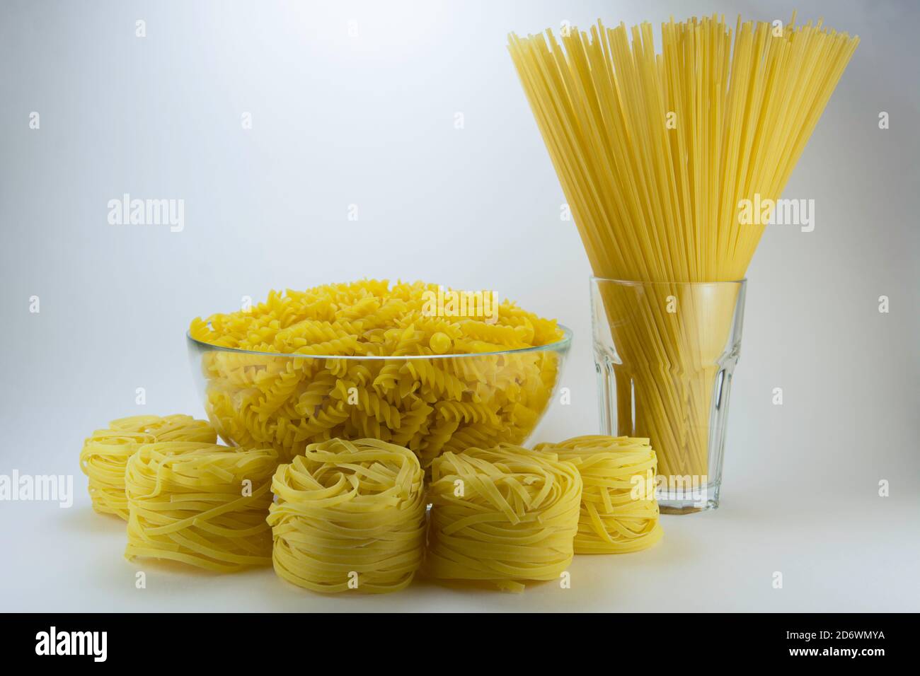 Yellow pasta on a white background. Different types of pasta Stock ...