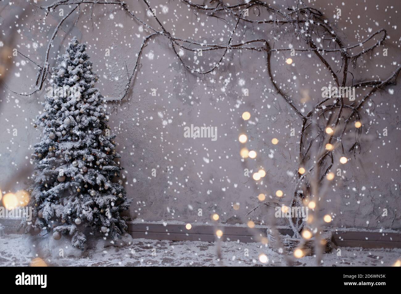Beautiful snowy christmas tree in the holiday interior. Empty space for ...