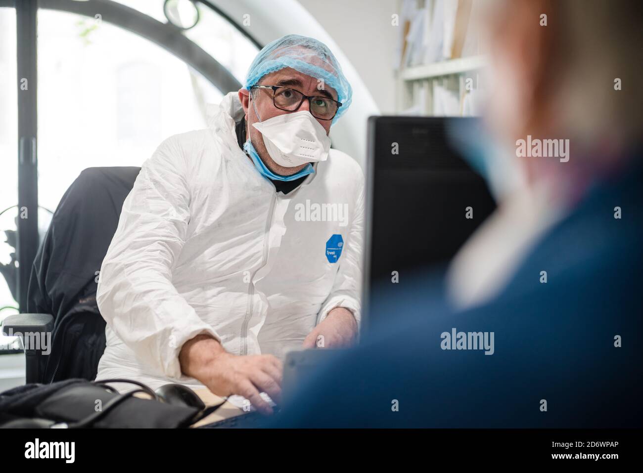 Doctor in Covid 19 screening consultation, Cosem Mirosmenil Medical ...