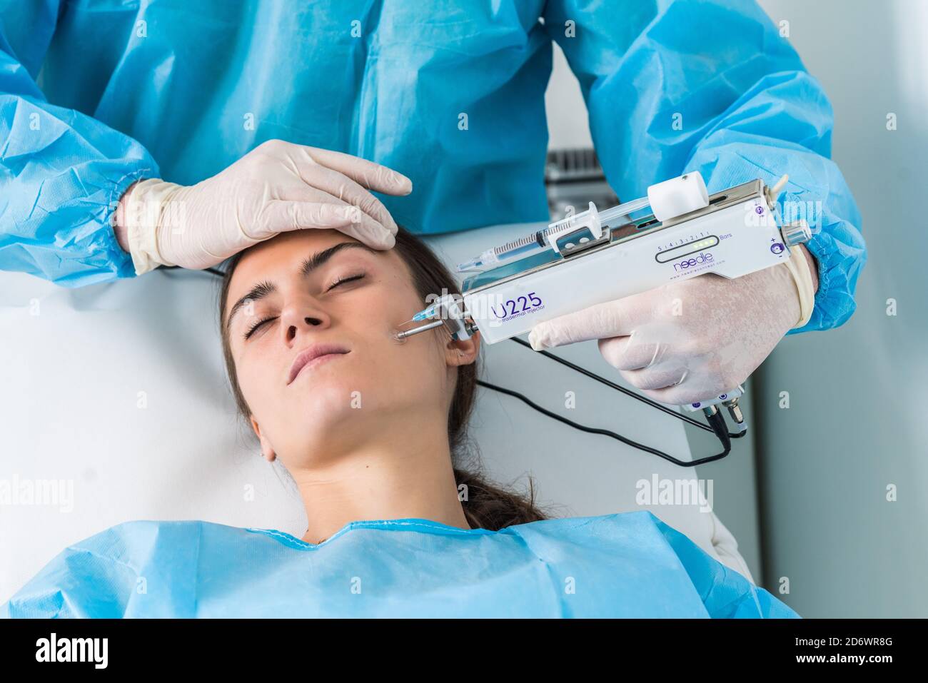 Doctor performing skin rejuvenation using Mesolift treatment consisting ...