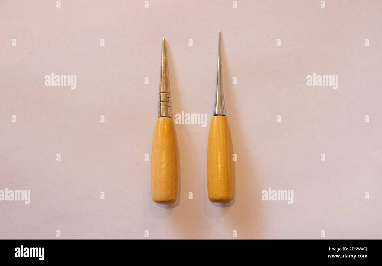 Two awls on a white background. Sewing tools Stock Photo - Alamy