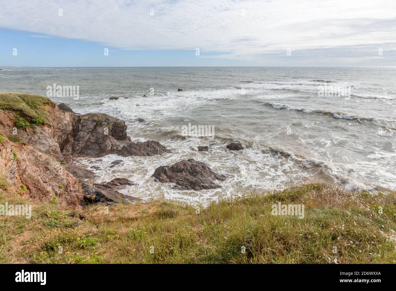 Breaking waves on the rocks of a cliff on the French Atlantic coast in ...