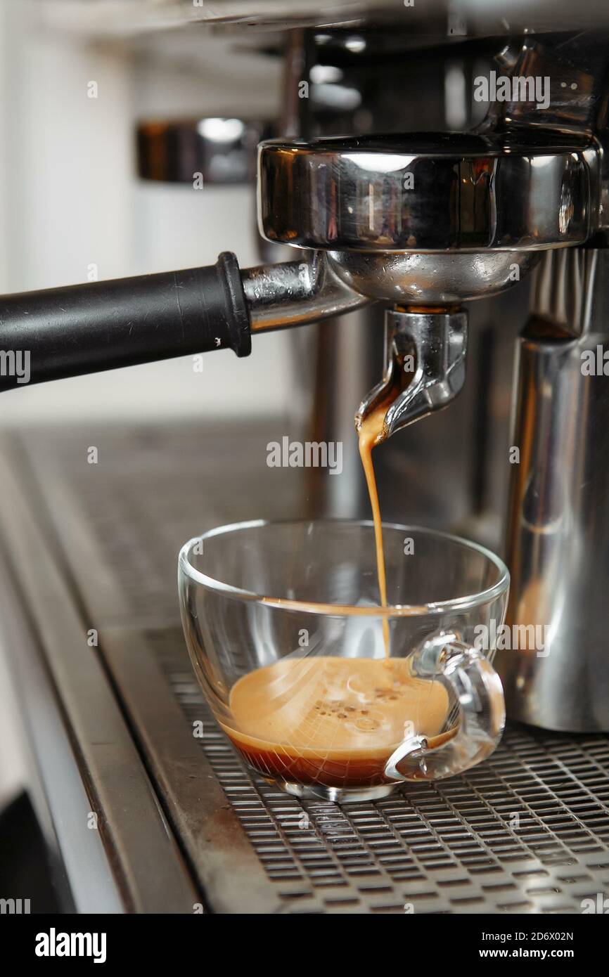 Professional coffee machine making espresso in a cafe Stock Photo - Alamy