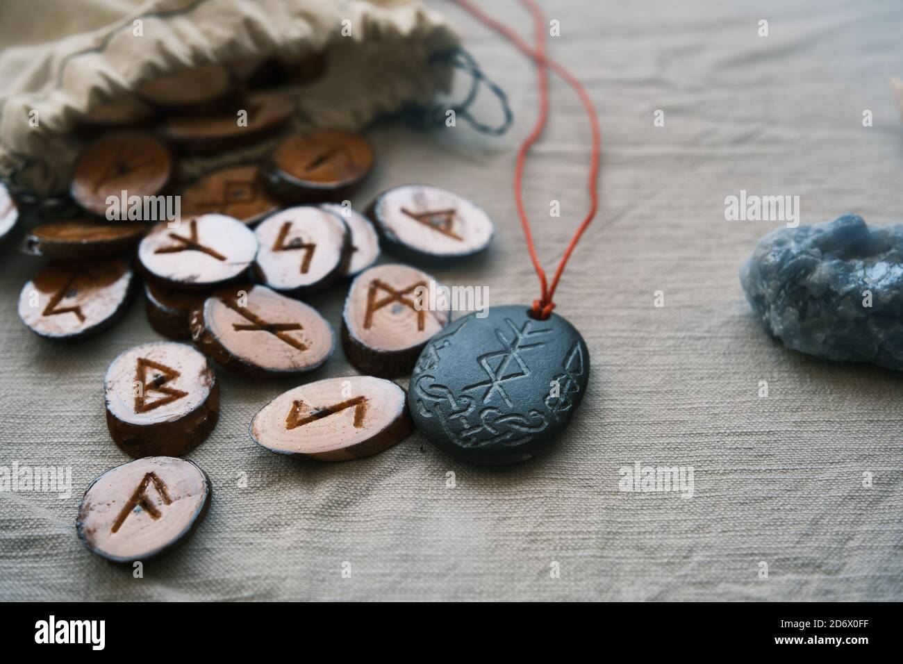 homemade wooden runes in a canvas bag with a talisman runoscript Stock ...