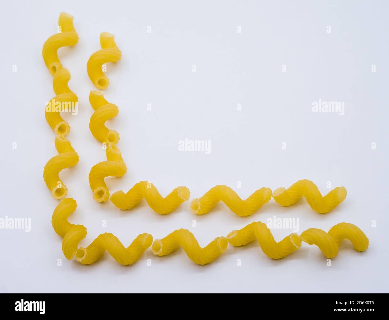 spiral macaroni, macaroni patterns, swirls of macaroni on a white ...