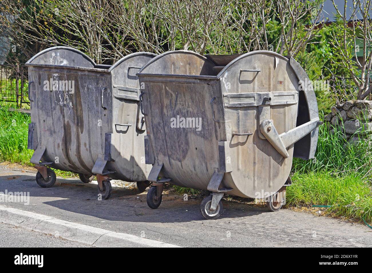 Two open dumpster bins containers at street Stock Photo - Alamy