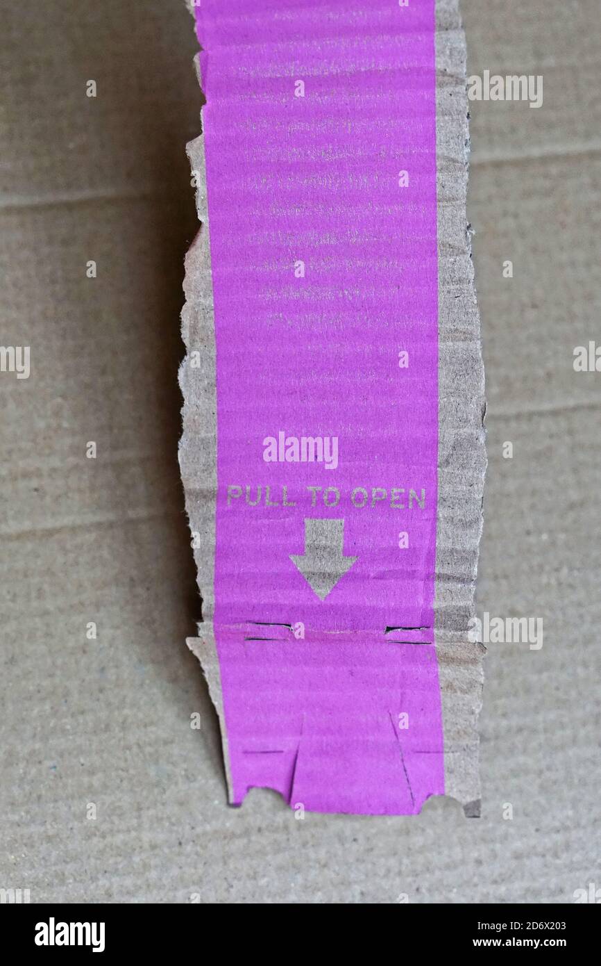 Pull to open easy strip at box package Stock Photo - Alamy
