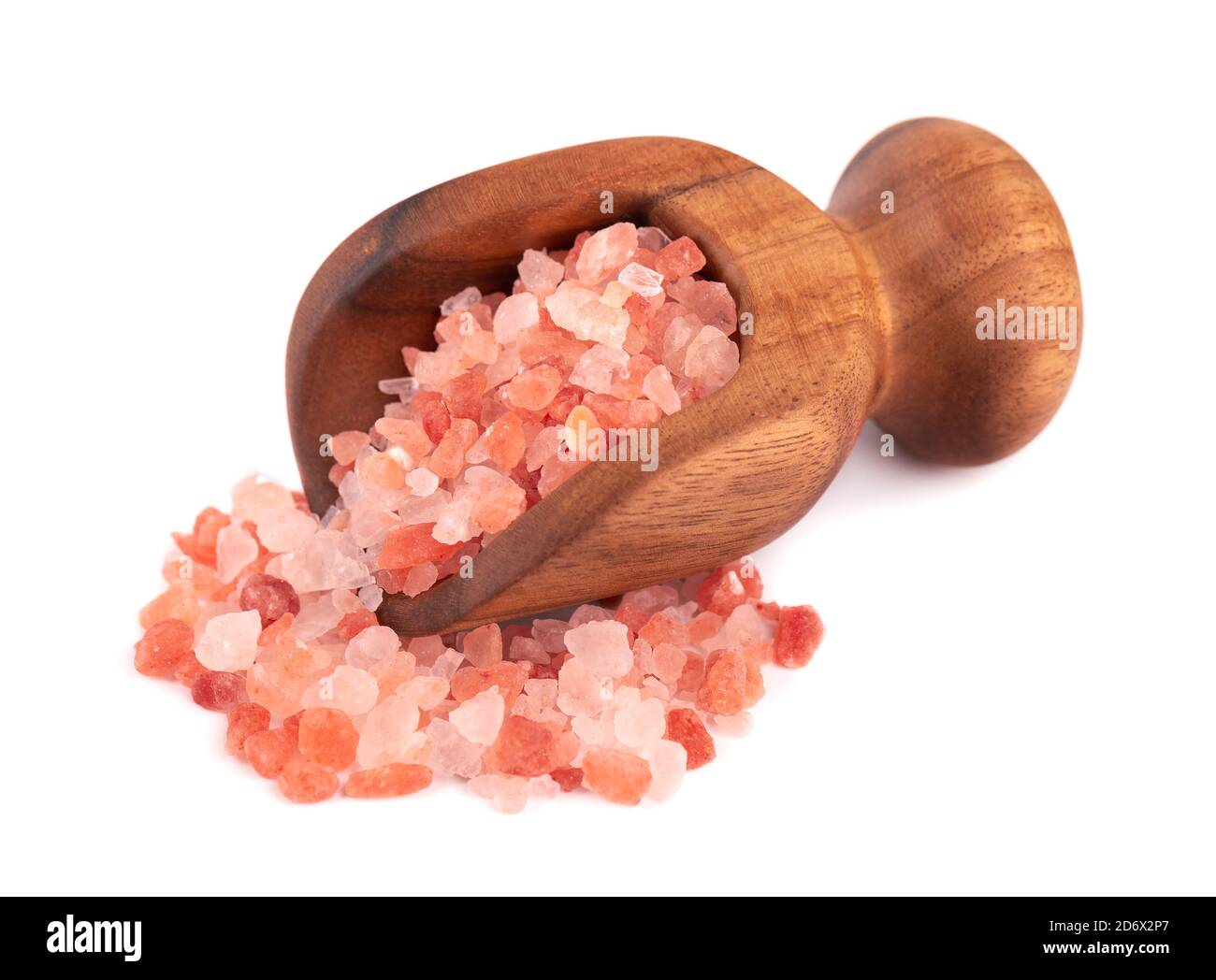 Himalayan pink salt in wooden scoop, isolated on white background ...