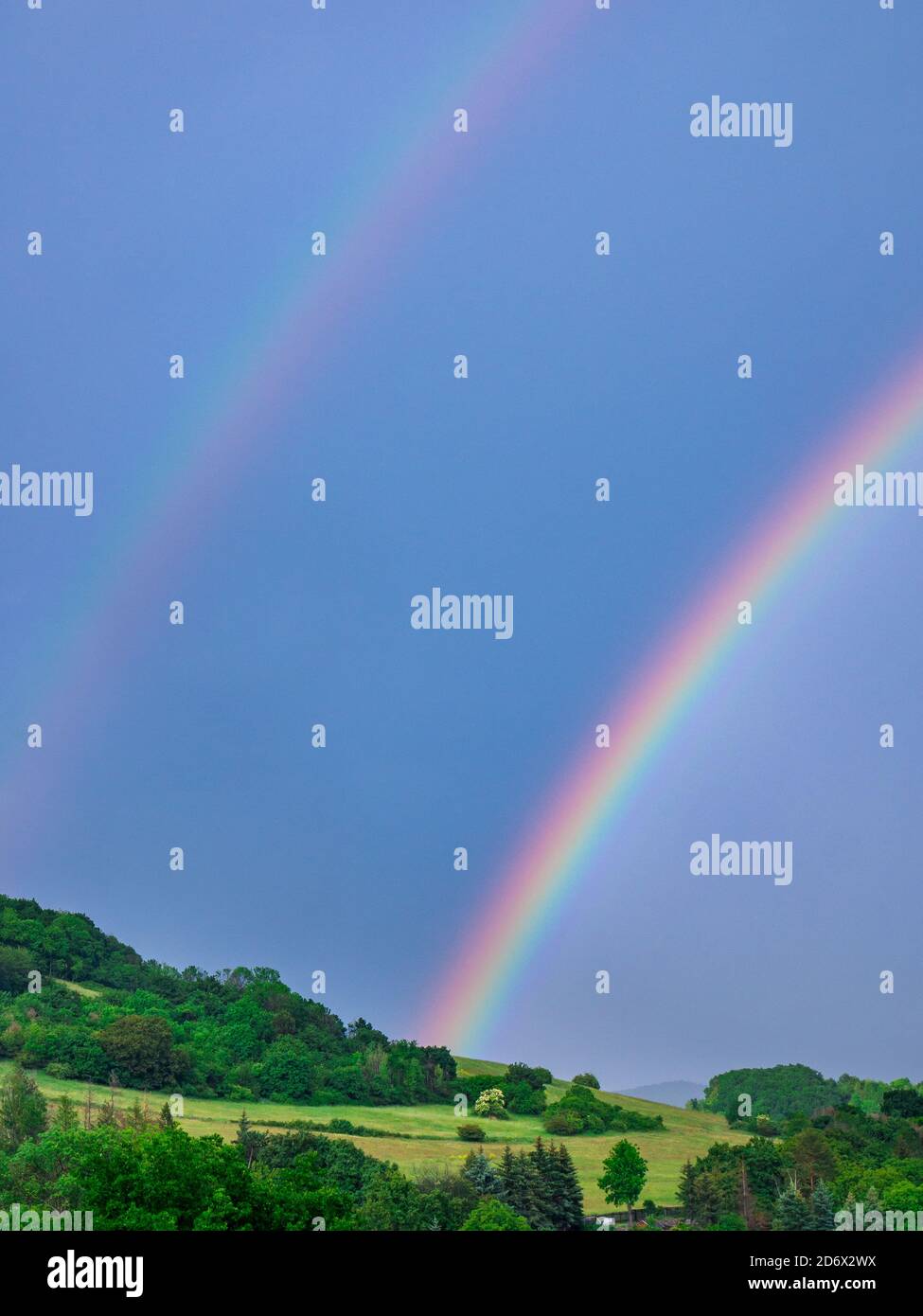 Rainbow over forest and field hi-res stock photography and images - Alamy
