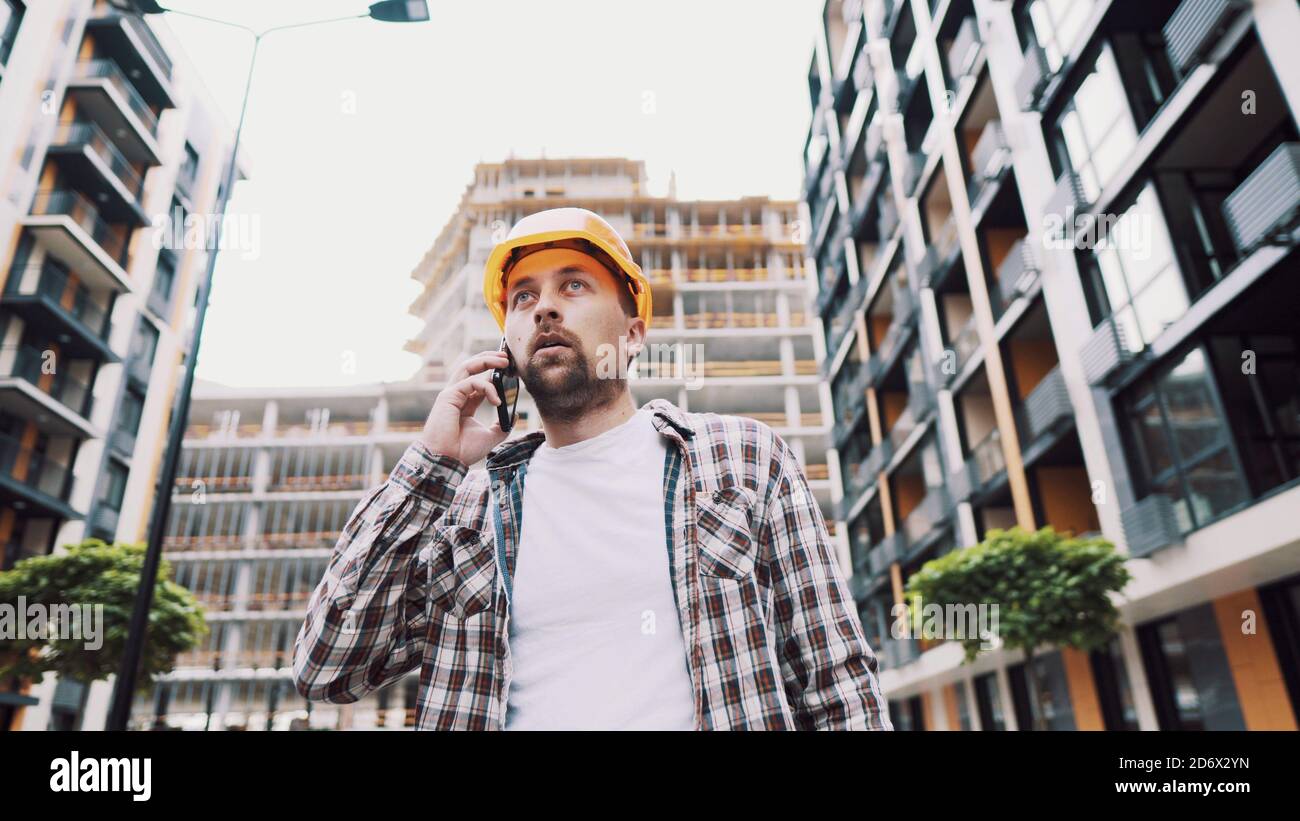Angry builder, dissatisfied with deadline of work, swears at stress ...