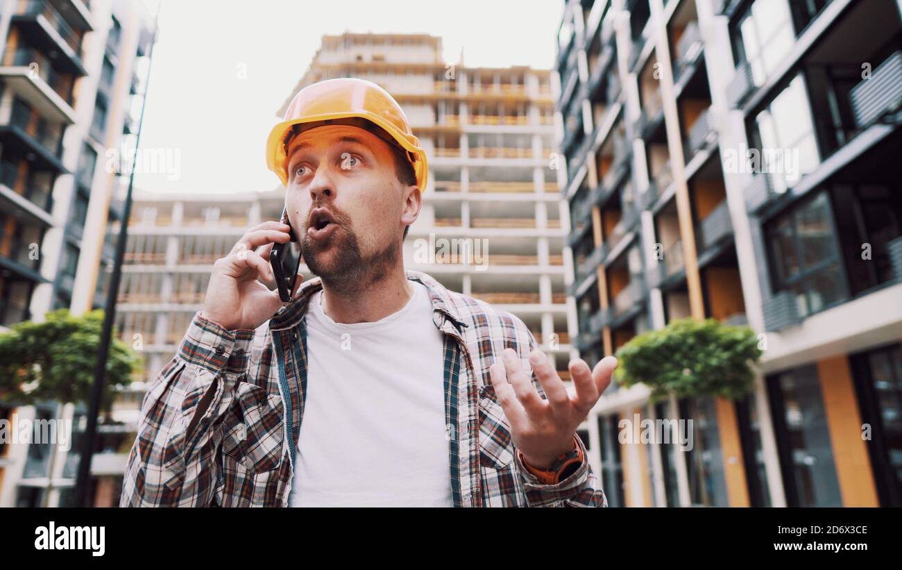 Angry builder, dissatisfied with deadline of work, swears at stress ...