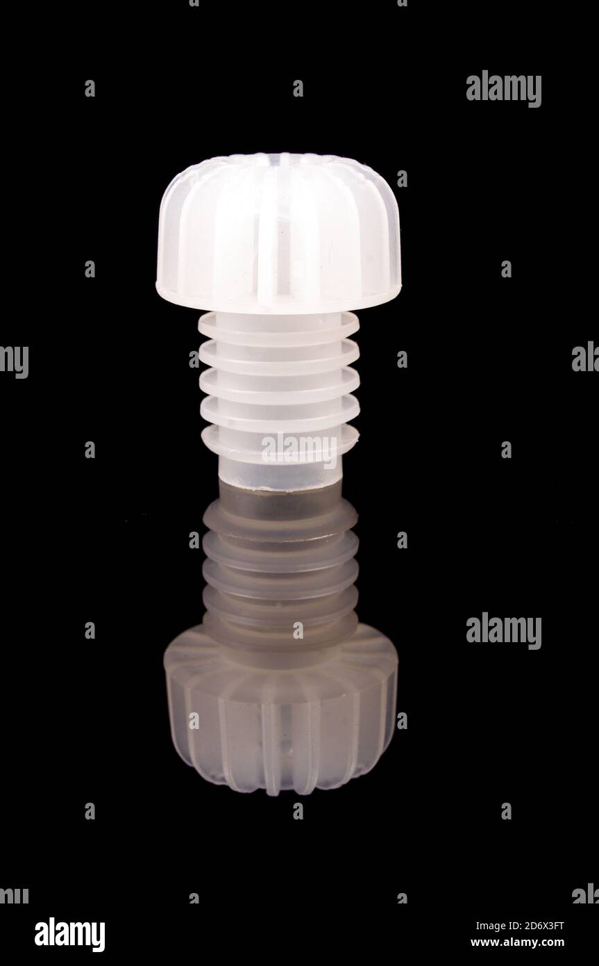 Plastic cork from sparkling wine isolated on black reflective ...