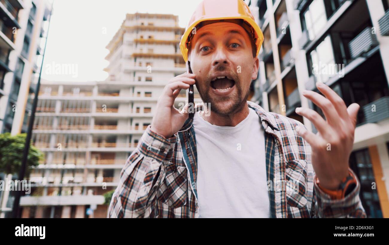 Angry builder, dissatisfied with deadline of work, swears at stress ...