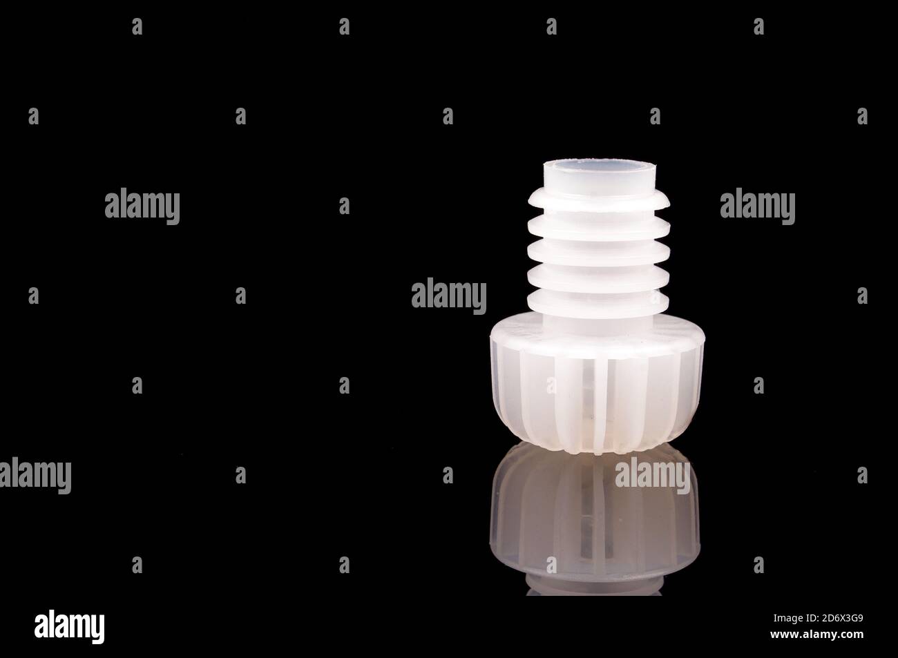 Plastic cork from sparkling wine isolated on black reflective ...